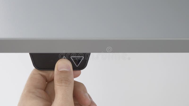 The Man Lifts Up a Desk of Variable Height for Standing Work Stock ...