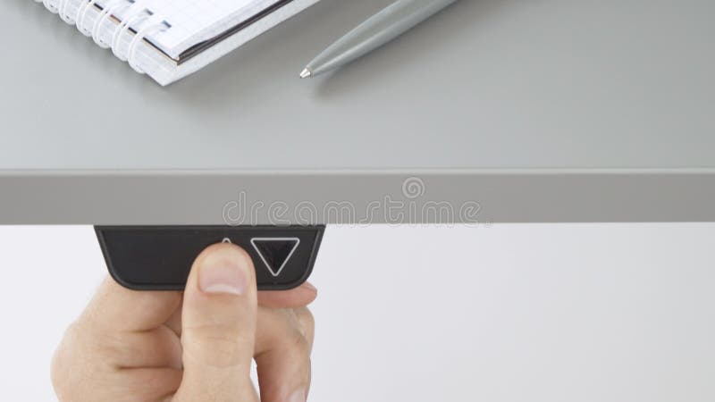 The Man Lifts Up a Desk of Variable Height for Standing Work Stock ...