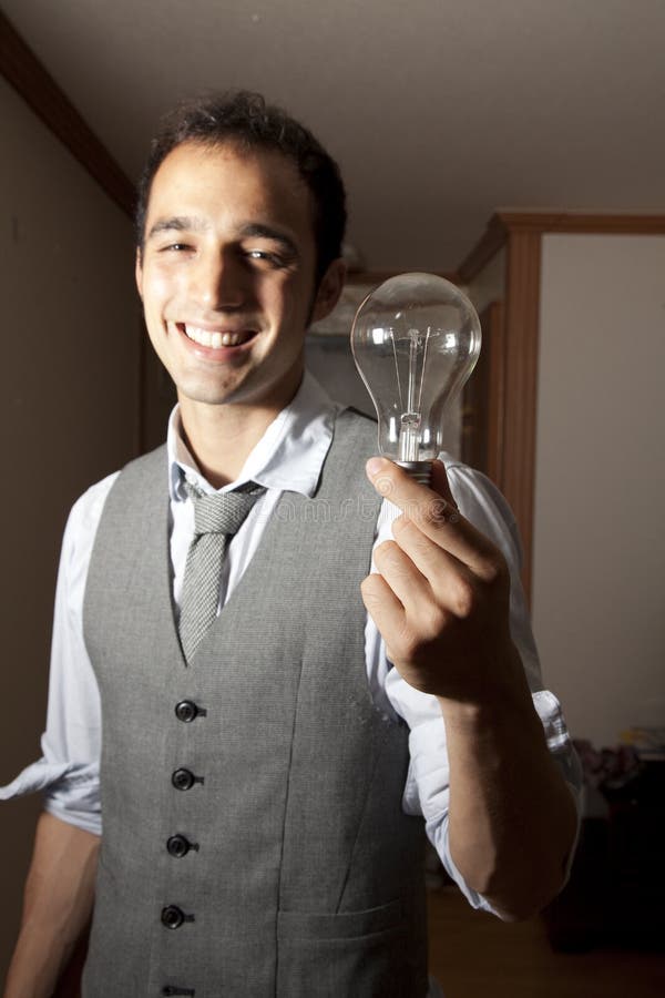 Man with a light bulb stock image. Image of planning - 20217767