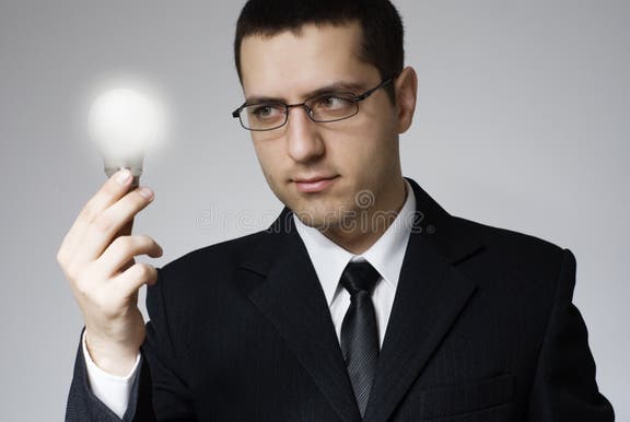 Man with light bulb stock image. Image of male, innovative - 4571521