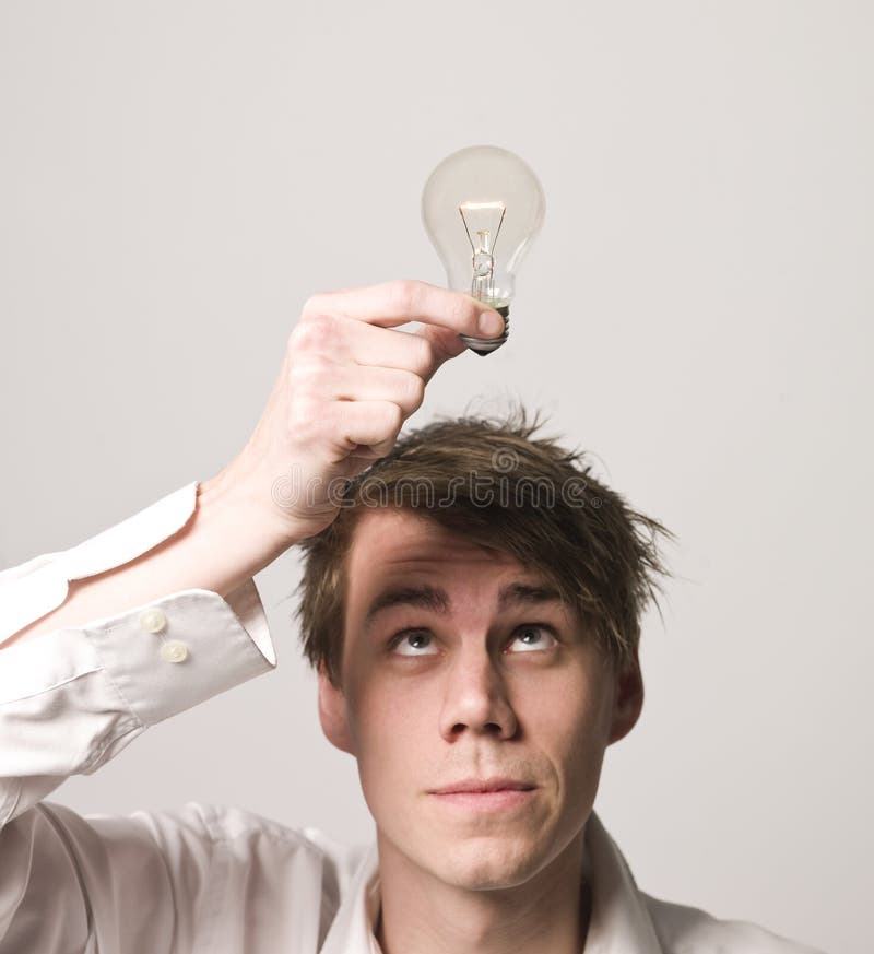 Man with light bulb stock photo. Image of voltage, holding - 9069752