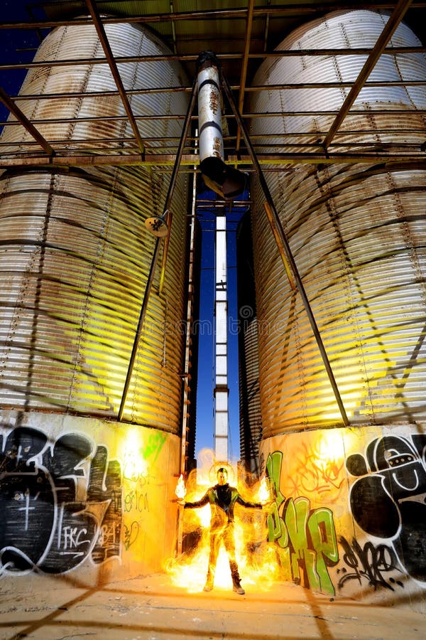 Burning Man Light Painted with Fire in Industrial Setting Stock Image ...