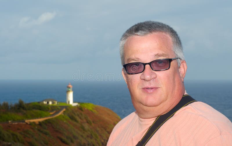 A man and a lighthouse stock image. Image of strap, caucasian - 10746355