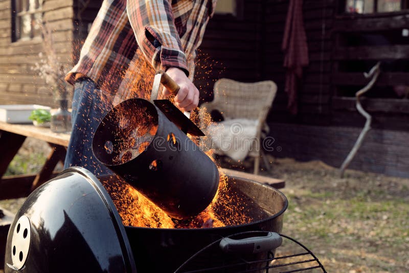 Man lighting the fire stock image. Image of meat, coal - 223410881