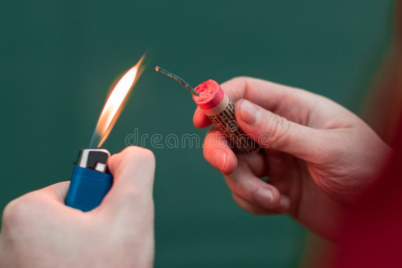 Man Lighting Up Firecracker in His Hand Stock Photo - Image of petard ...