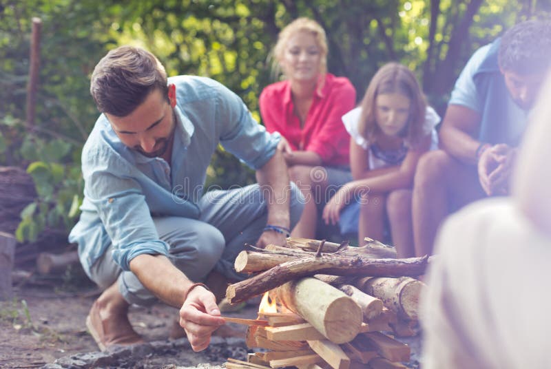Man Lighting Up the Woods for Bonfire Stock Photo - Image of food ...