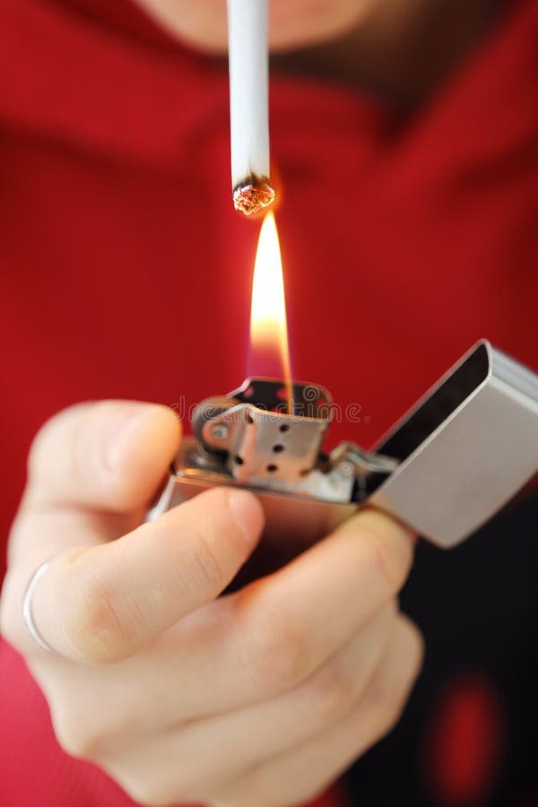 Man Lights a Cigarette Lighter with Fire Stock Image - Image of silver ...