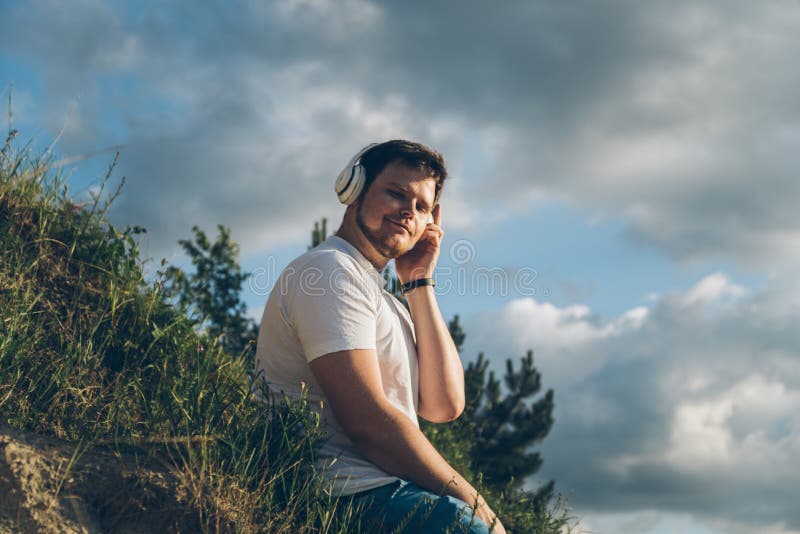 Man Listen Music on the Peak of the Hill Stock Image - Image of sunset ...