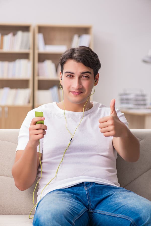 The Man Listening Music Sitting In Couch Stock Image Image Of Audio