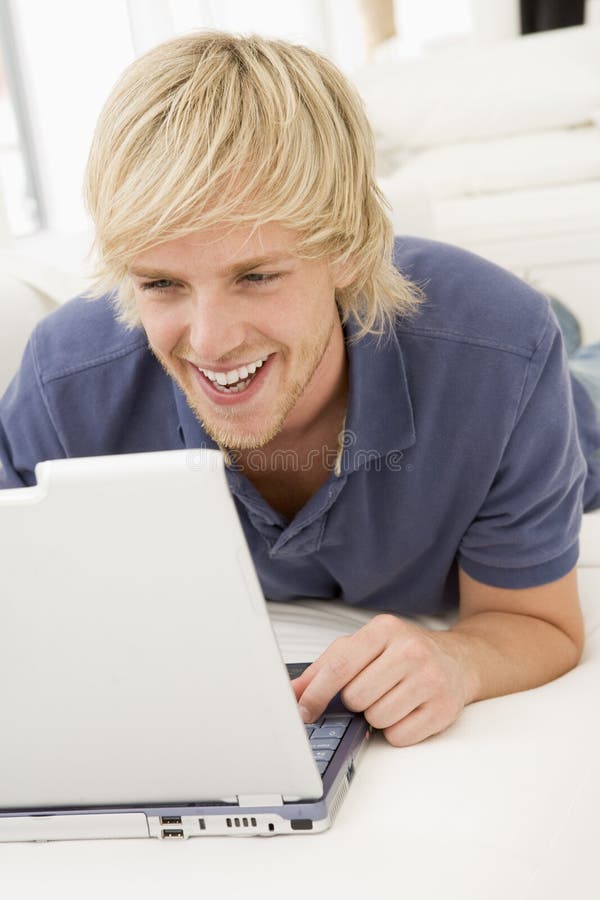 Man in Living Room with Laptop Stock Image - Image of happy, smiling ...