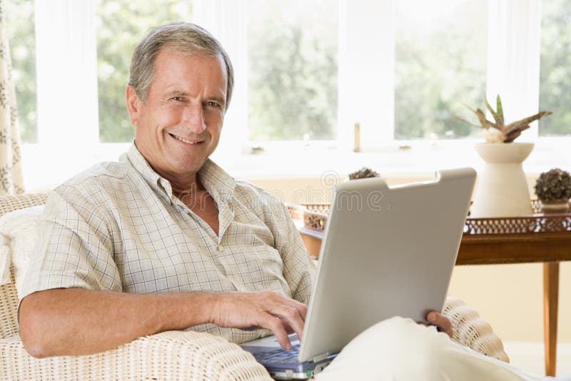 Man in Living Room with Laptop Smiling Stock Photo - Image of roomemale ...