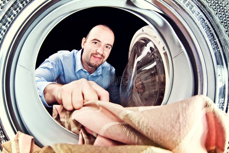 Man load washing machine stock photo. Image of fisheye - 27219658