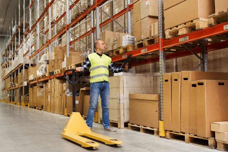 Man with Loader and Clipboard at Warehouse Stock Photo - Image of ...