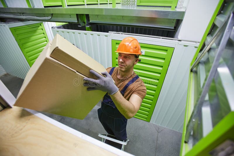 Man loading the boxes stock photo. Image of packaging - 171899460