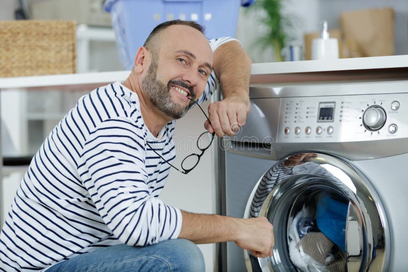 467 Man Loading Clothes Washing Machine Stock Photos - Free & Royalty ...