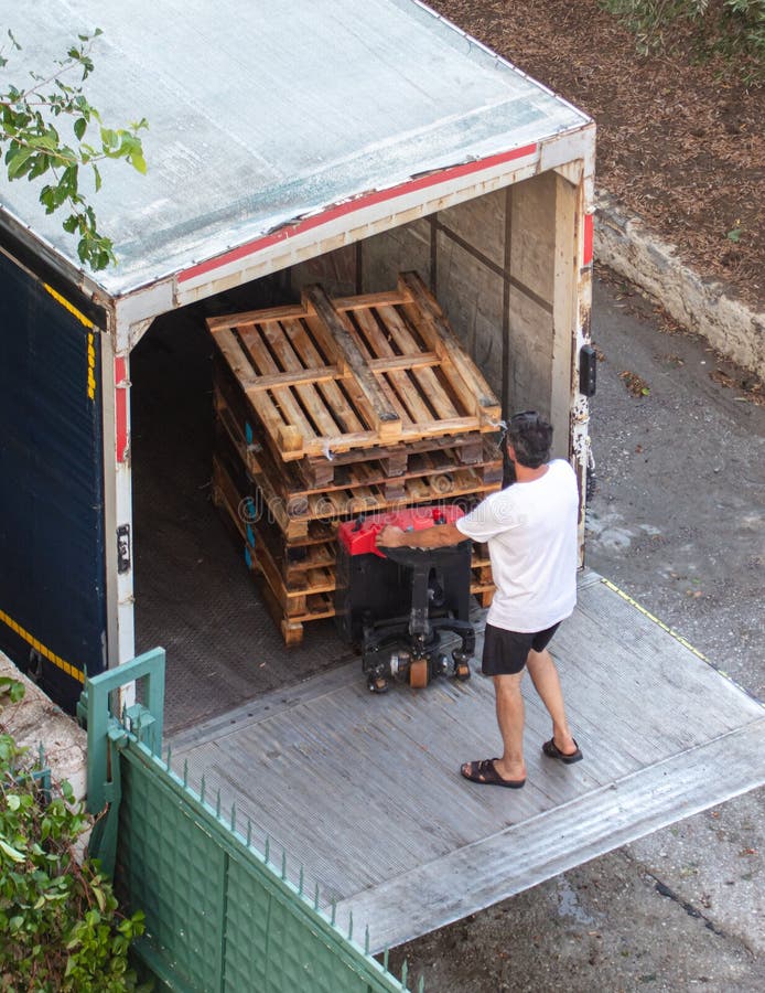 A Man is Loading Goods into Truck. Editorial Image - Image of delivery ...