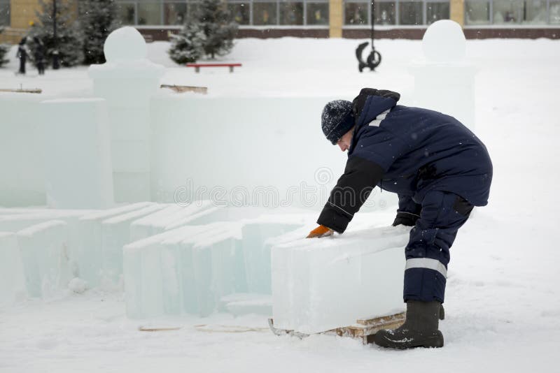 A Worker Loads Ice Blocks Onto a Sled Stock Image - Image of concept ...