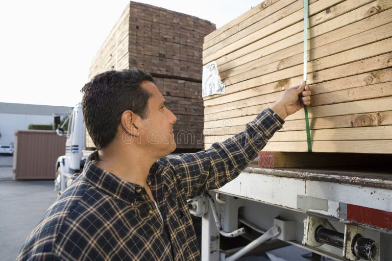 Man Loading Stack of Plank on Trailer Stock Image - Image of employment ...