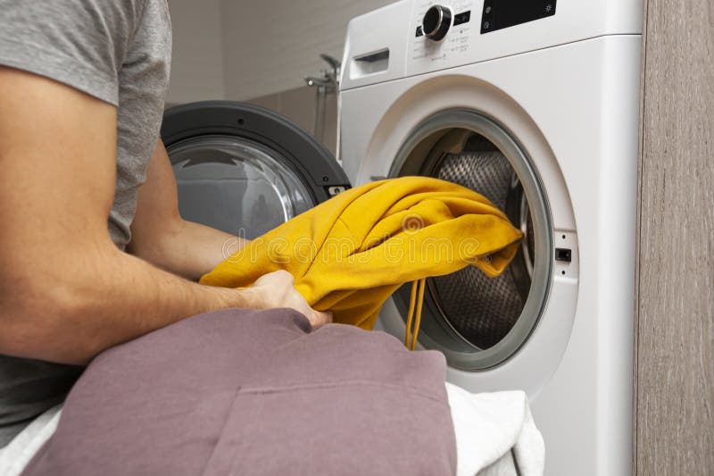 Man Loading the Washer Dryer Stock Photo - Image of adult, casual ...