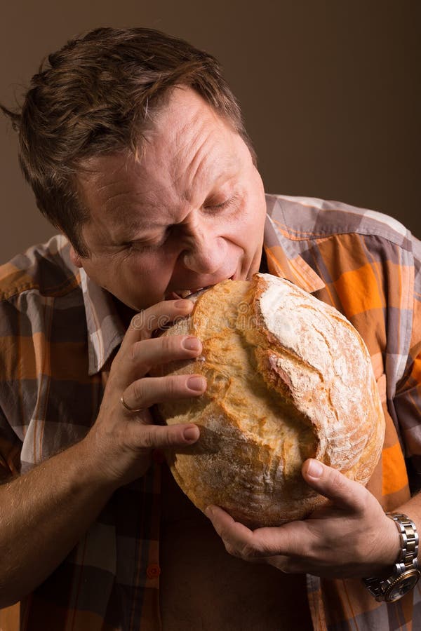 Man and loaf of bread stock image. Image of country - 133821905