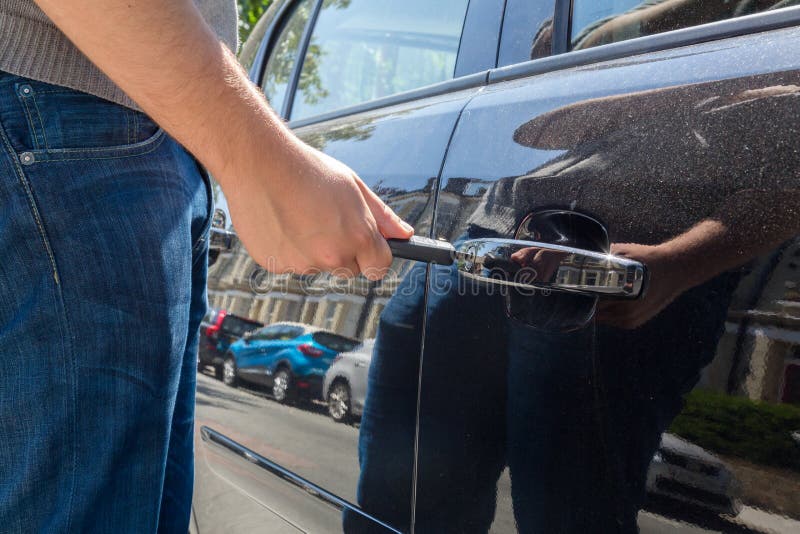 Man Locking or Unlocking a Car Door Stock Photo - Image of locked ...