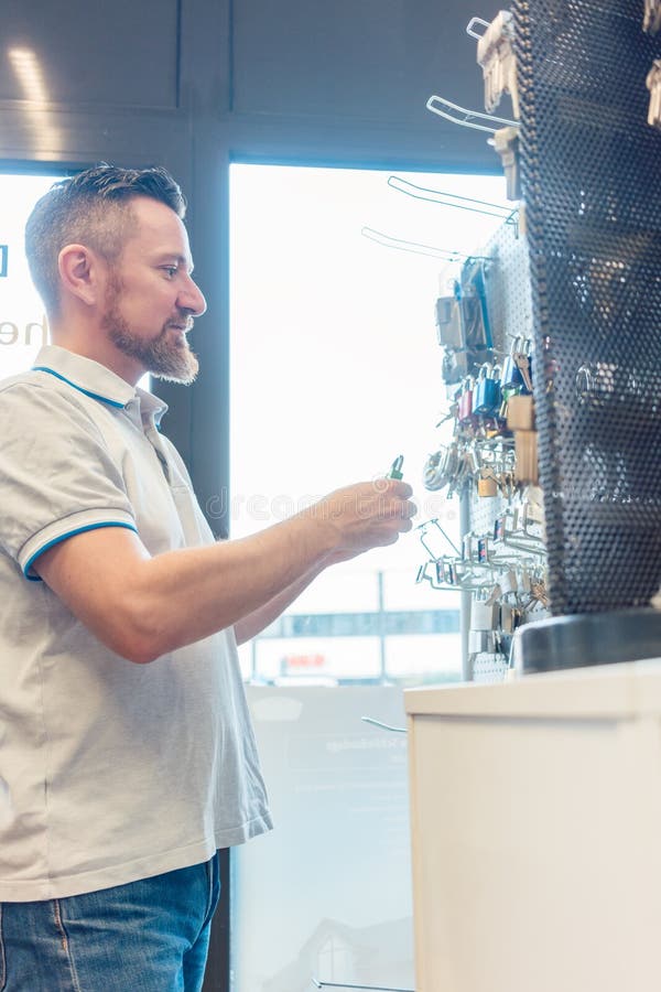 Man Locksmith Choosing Key Blank Stock Photo - Image of male, shop ...