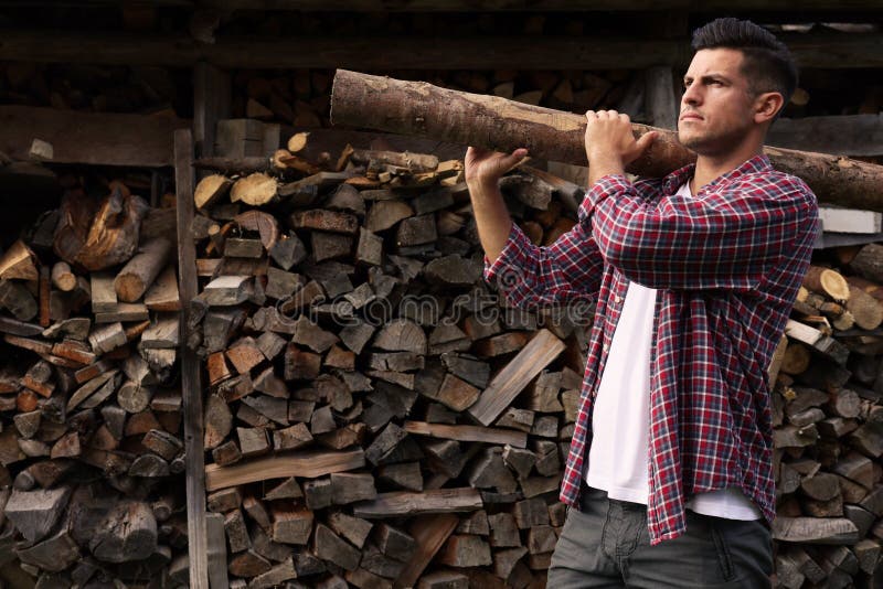 Man with Log Near Wood Pile Outdoors Stock Image - Image of pile ...