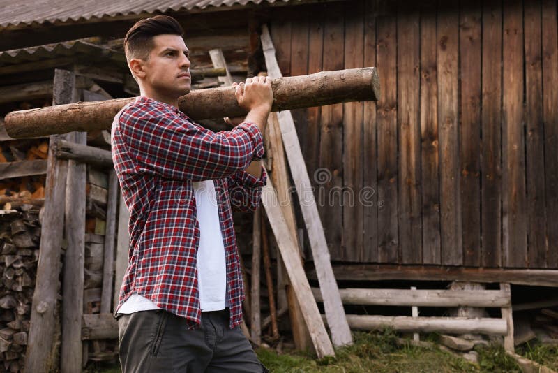 Man with Log Near Wood Pile Outdoors Stock Image - Image of handsome ...