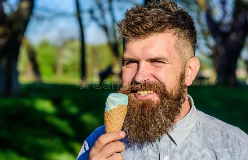 Man With Long Beard Enjoy Ice Cream Close Up Chilling Concept Stock