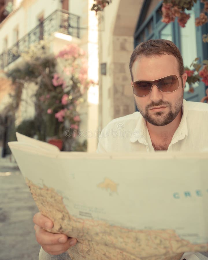Man look through map stock photo. Image of tourism, summer - 40121564