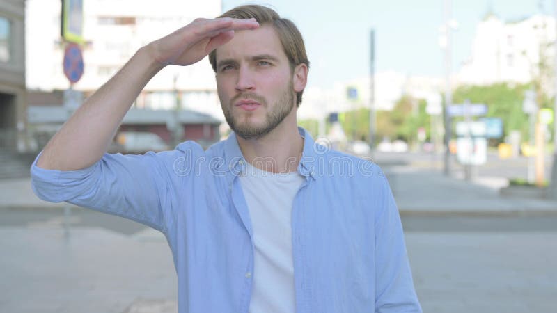 Young Man Looking Around for Opportunity Outdoor Stock Image - Image of ...