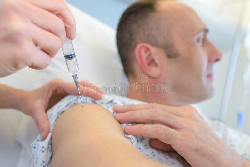 Man Looking Away while Having Injection in Arm Stock Image - Image of ...