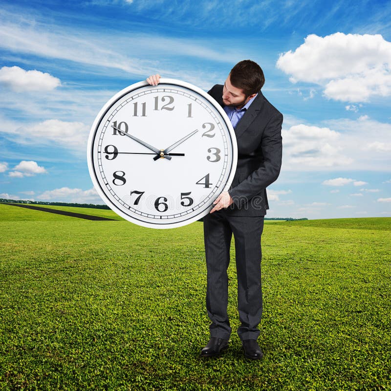 Man Looking at Big Clock at Outdoor Stock Image - Image of business ...
