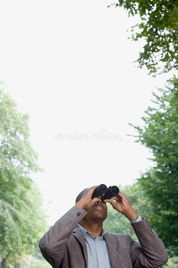 Man Looking through Binoculars Stock Image - Image of holding, american ...