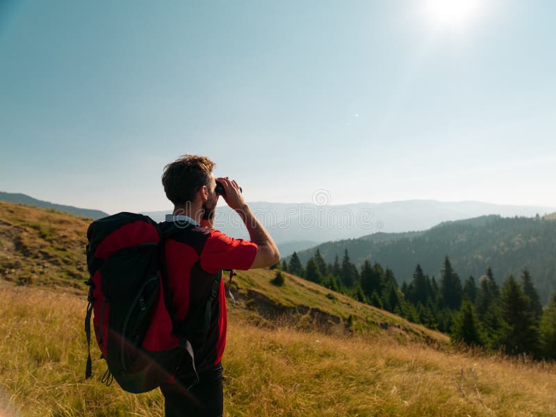 Man Looking through Binoculars Stock Photo - Image of trekking ...