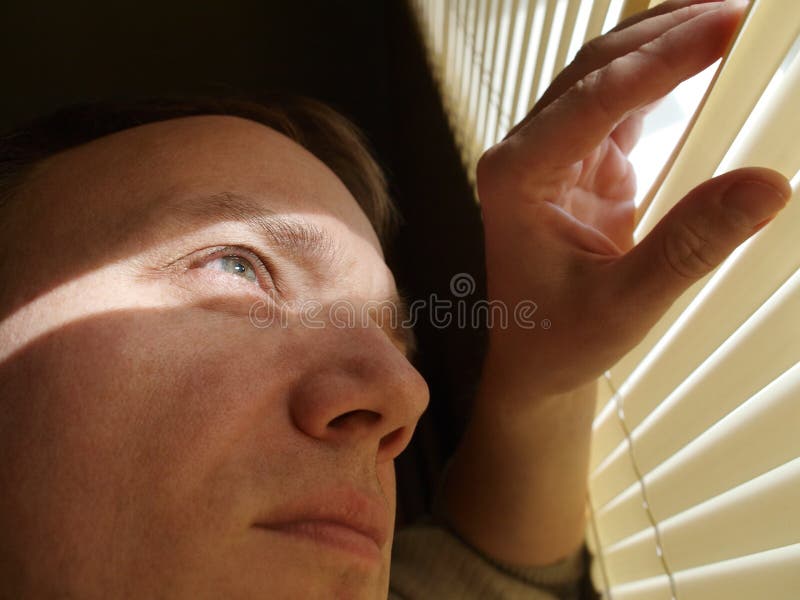 Man looking through blinds stock image. Image of investigator - 38069869