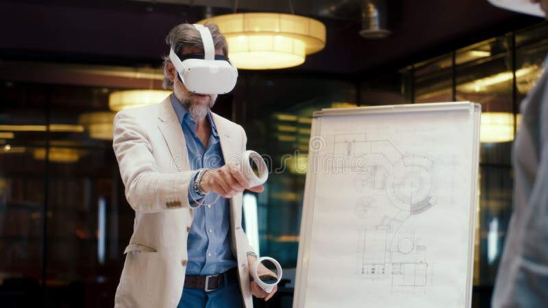 Man Looking at Blueprint in VR Headset Stock Image - Image of virtual ...