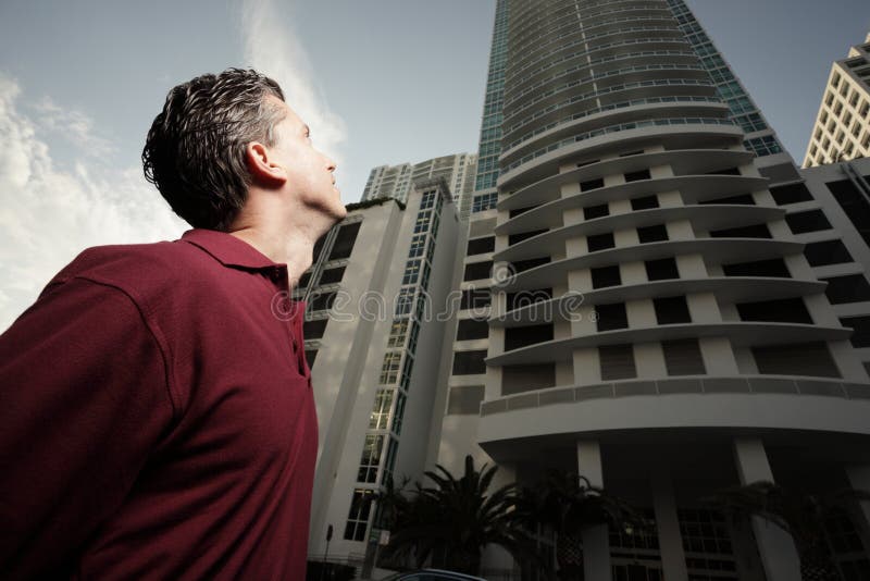 Man looking at a building stock photo. Image of male, towering - 8477000