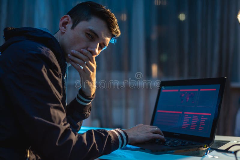 Man Looking in the Camera. Hacker Attacks and Stealing Access Databases with Passwords. Cyber ...