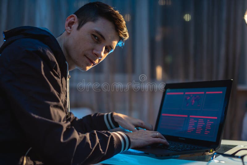 Man Looking In The Camera Hacker Attacks And Stealing Access Databases With Passwords Cyber