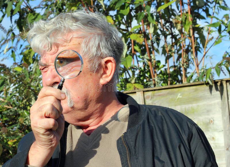 Man Looking at Camera through a Magnifier Lens.. Stock Photo - Image of ...