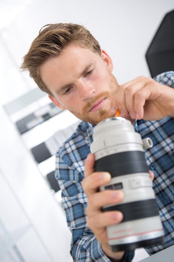 Man looking at camera zoom stock image. Image of photograph - 123599115