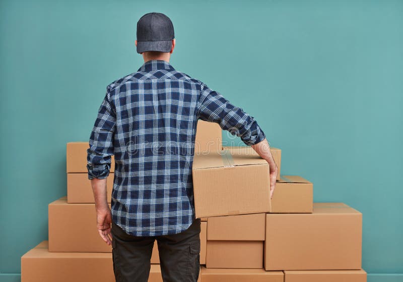 Man Looking at Cardboard Boxes Stock Image - Image of expertise ...