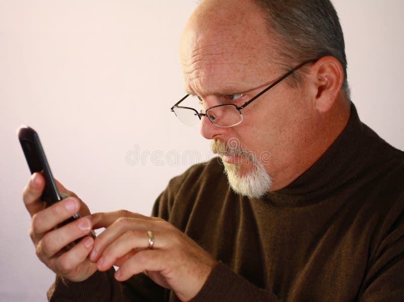 Man Looking At Cell Phone Royalty Free Stock Image - Image: 13342586