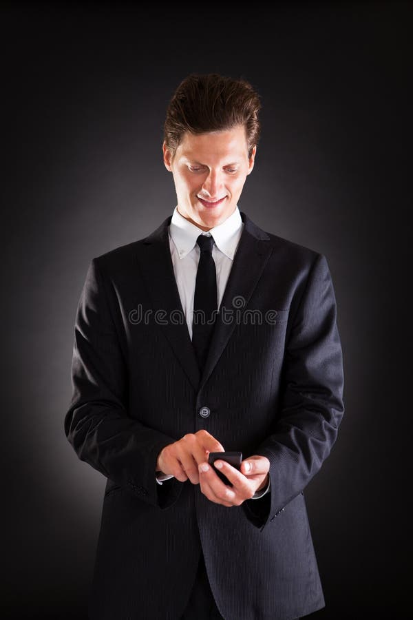 Man Looking at Cellphone stock photo. Image of people - 34959538