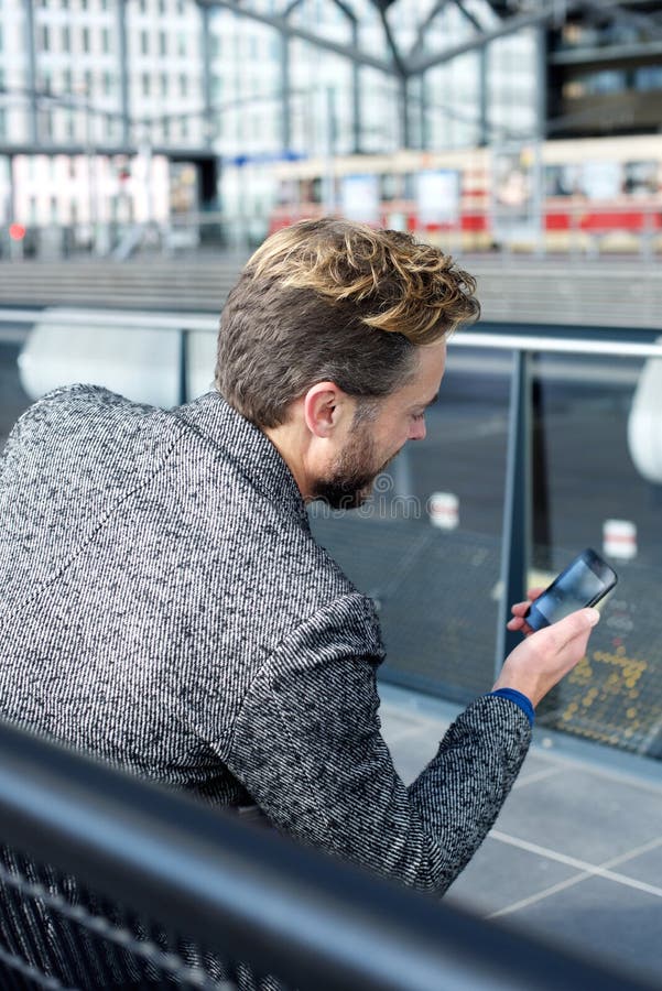 Man looking at cellphone stock image. Image of leaving - 60918795