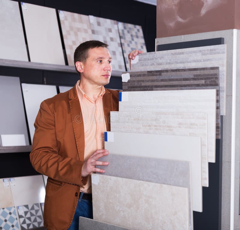 Man Looking at Ceramic Tile Stock Image - Image of construction ...