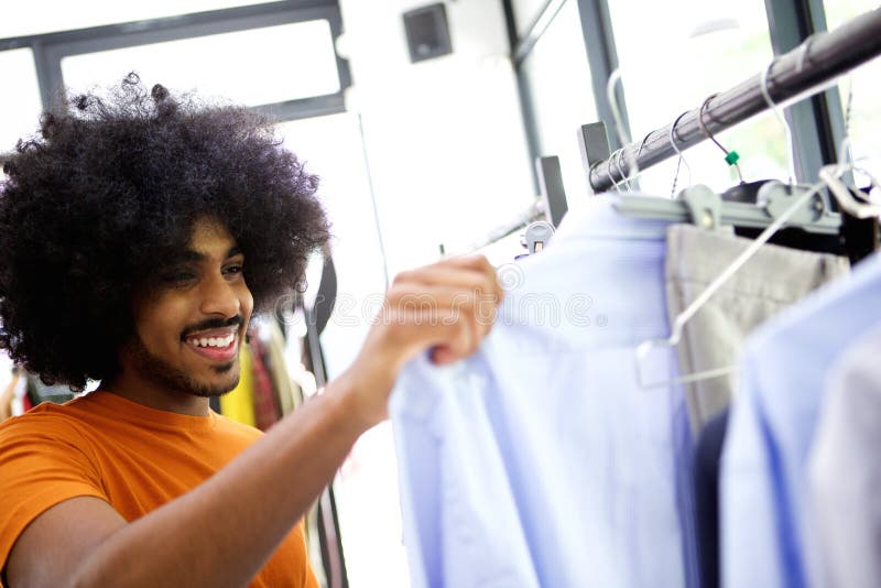 Man Looking at Clothes at Store Stock Photo - Image of dress, buyer ...