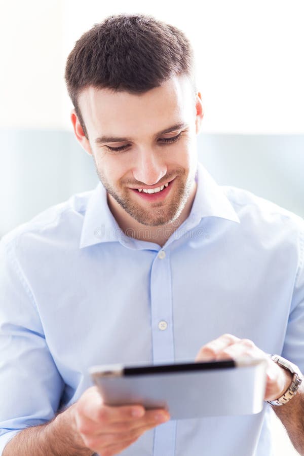 Man Looking at Digital Tablet Stock Image - Image of carefree, casual ...