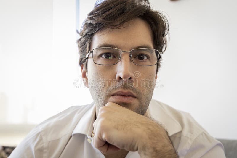 Man Looking Directly at the Camera Making a Conference Call Stock Photo ...